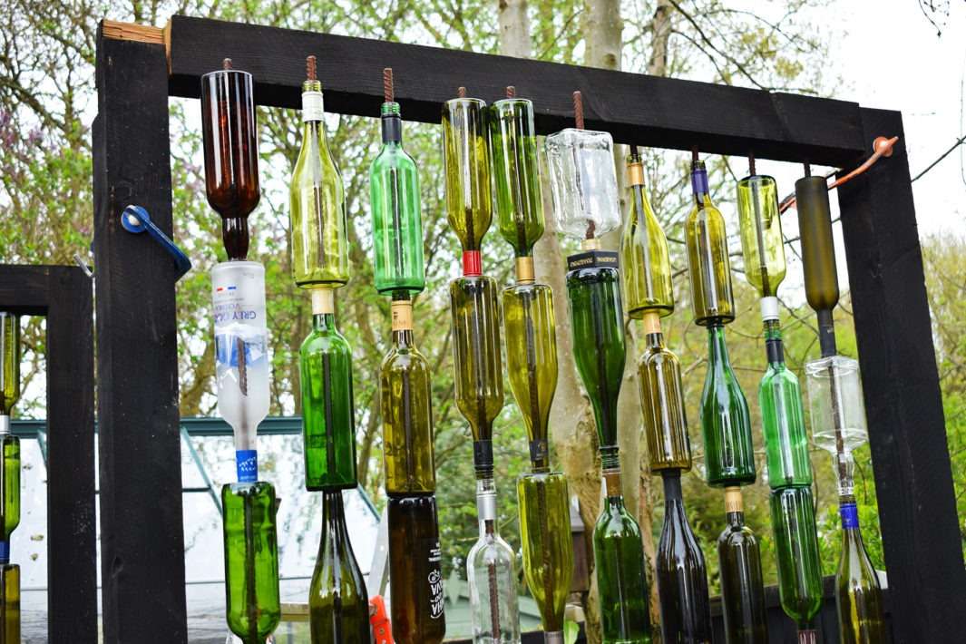 How to make a wine bottle screen garden feature - Daring Home Decor